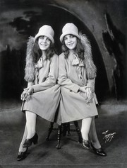 Daisy and Violet Hilton, conjoined twins, dressed to go out. Photograph ...
