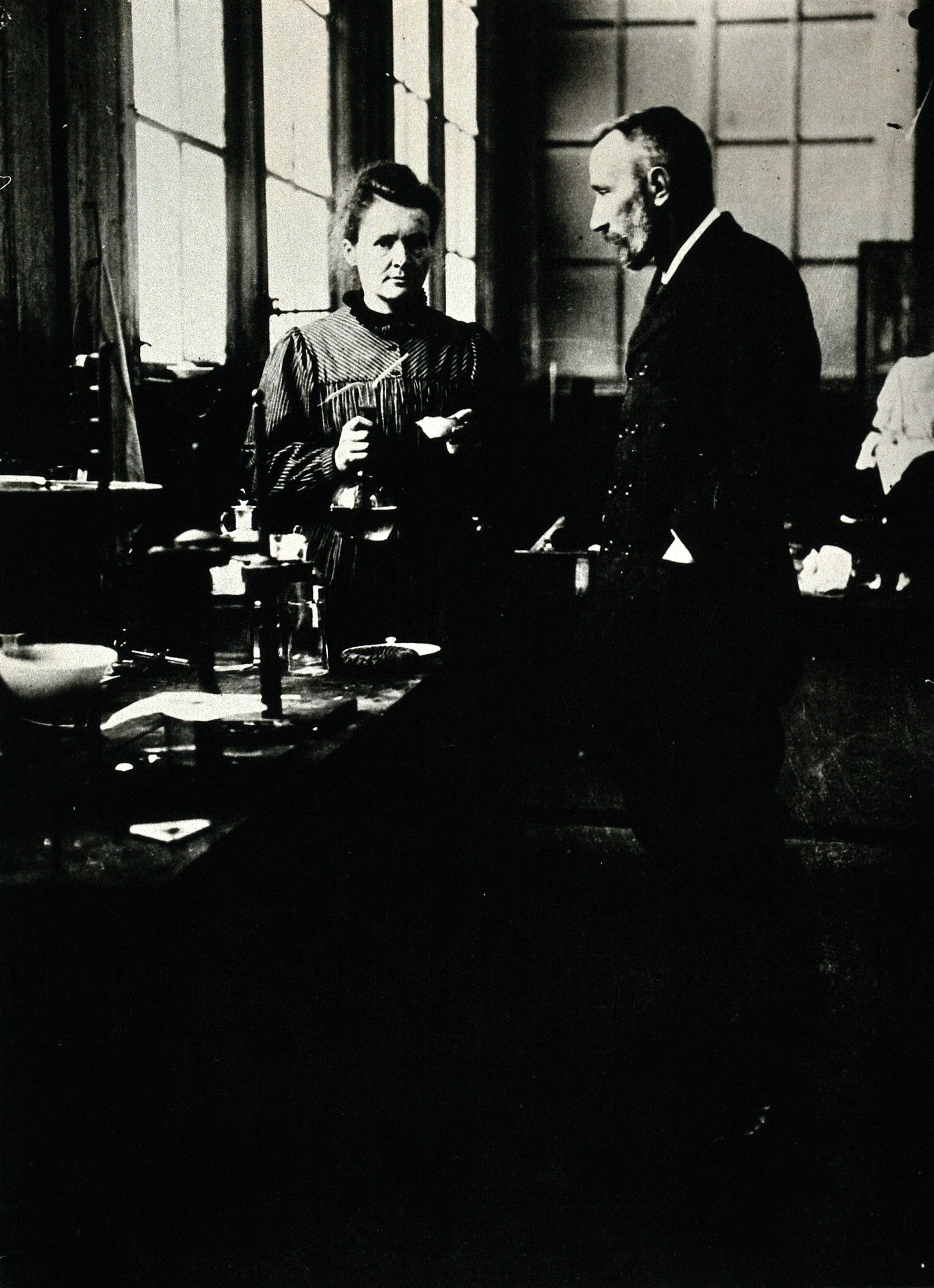 Marie and Pierre Curie in their laboratory, Paris. Photograph, ca. 1900 ...