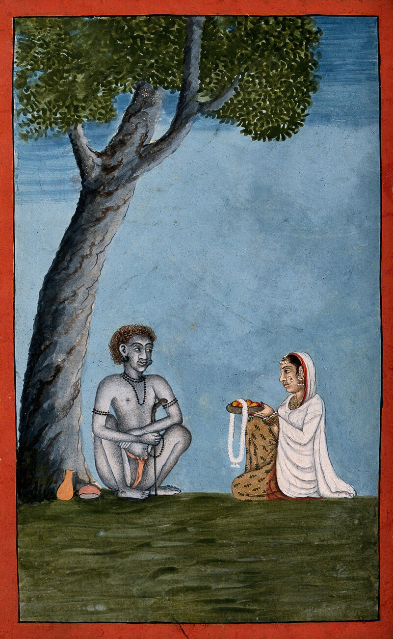 A Hindu ascetic or holy man, seated under a tree, receiving food from a ...