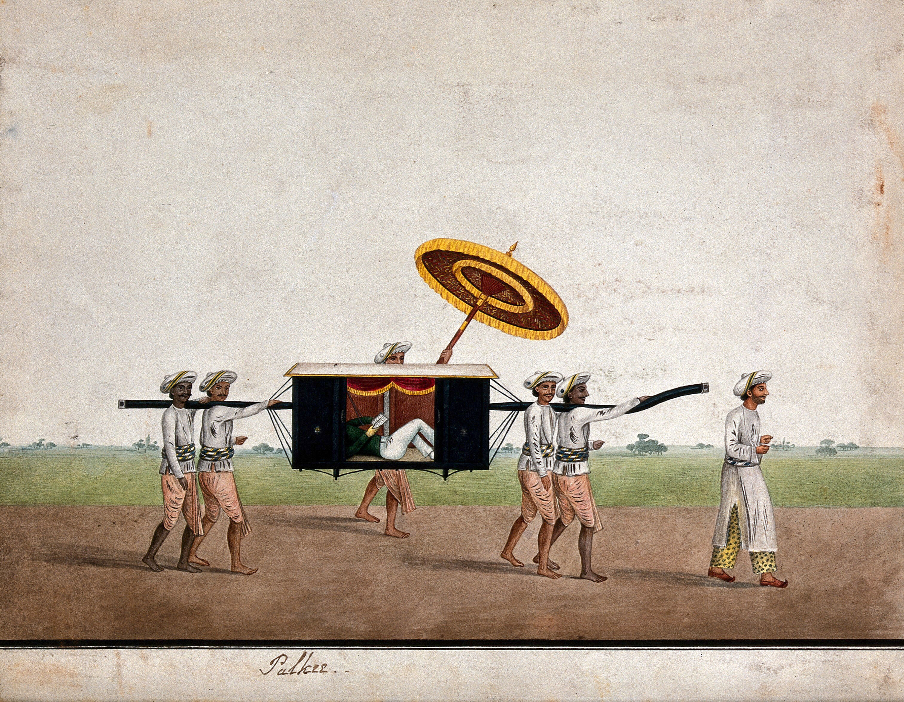 An European man relaxing and reading a book in a palkee carried by four ...